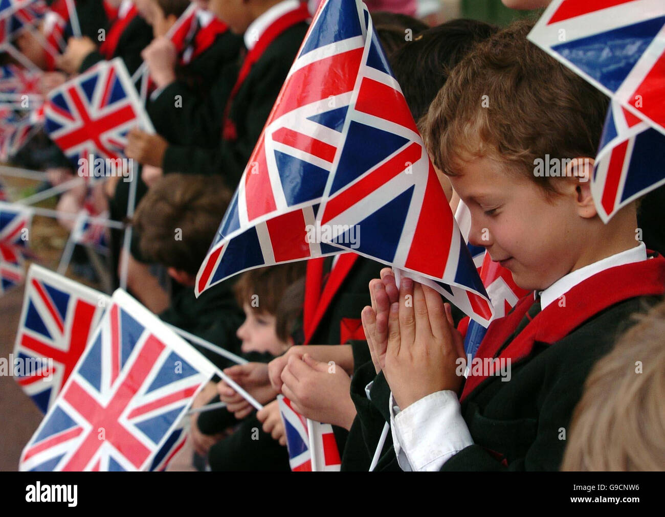 Children with flags joins in prayers before at a service for Chelsea ...