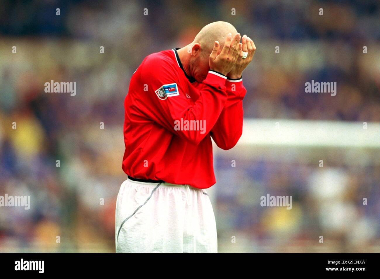 Manchester United's David Beckham holds his head in his hands after ...