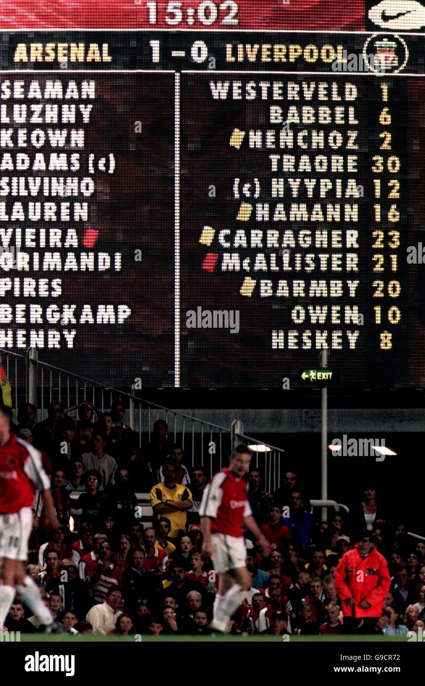 Arsenal's electronic scoreboard shows the story of the game so far with ...