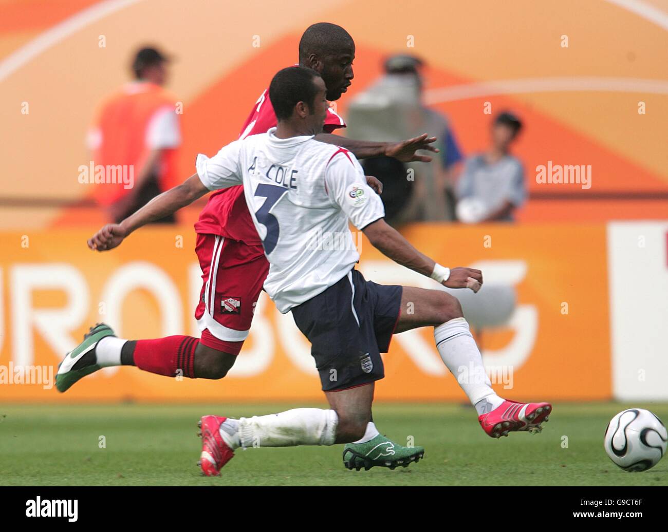 England's Ashley Cole challenges and Trinidad & Tobago's Cornell Glen ...