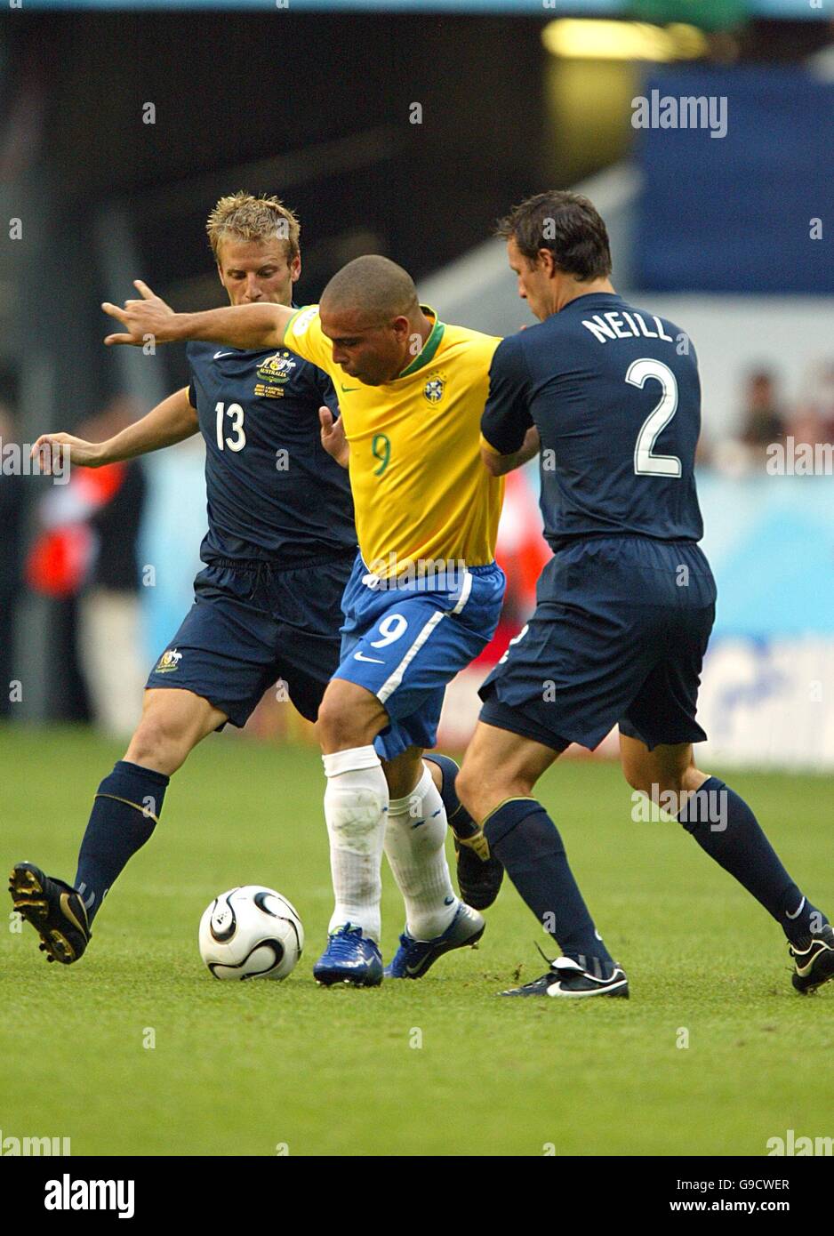 Australias lucas neill vince grella combine to tackle brazils ronaldo ...