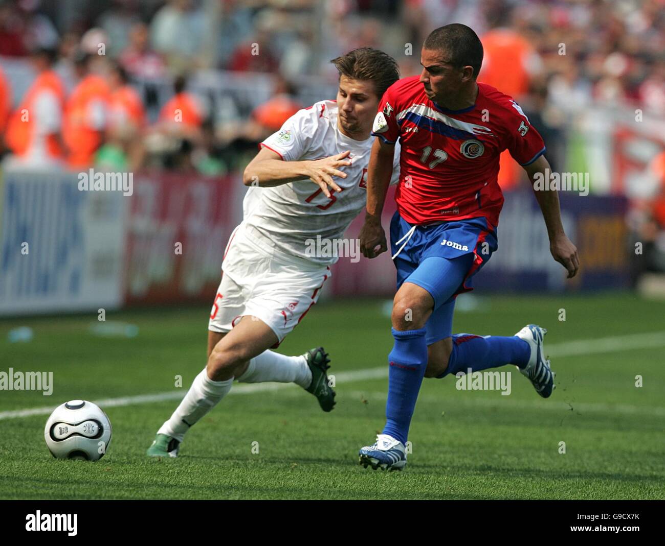Ebi Smolarek, Poland (L) and Gabriel Badilla, Costa Rica battle for the ...