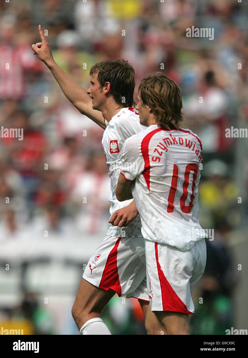 Bartosz Bosacki (L) celebrates after equalising for Poland Stock Photo ...