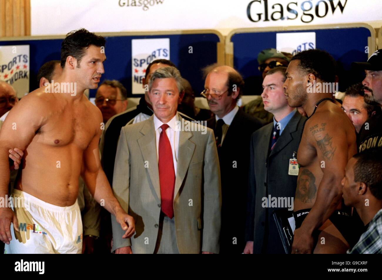 Mike Tyson (r) goes head to head to with Lou Savarese (l) at the weigh ...