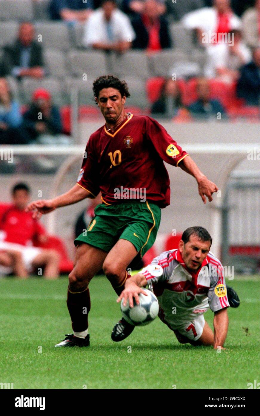 Portugal's Rui Costa (l) looks on as Turkey's Okan Buruk (r) reaches ...