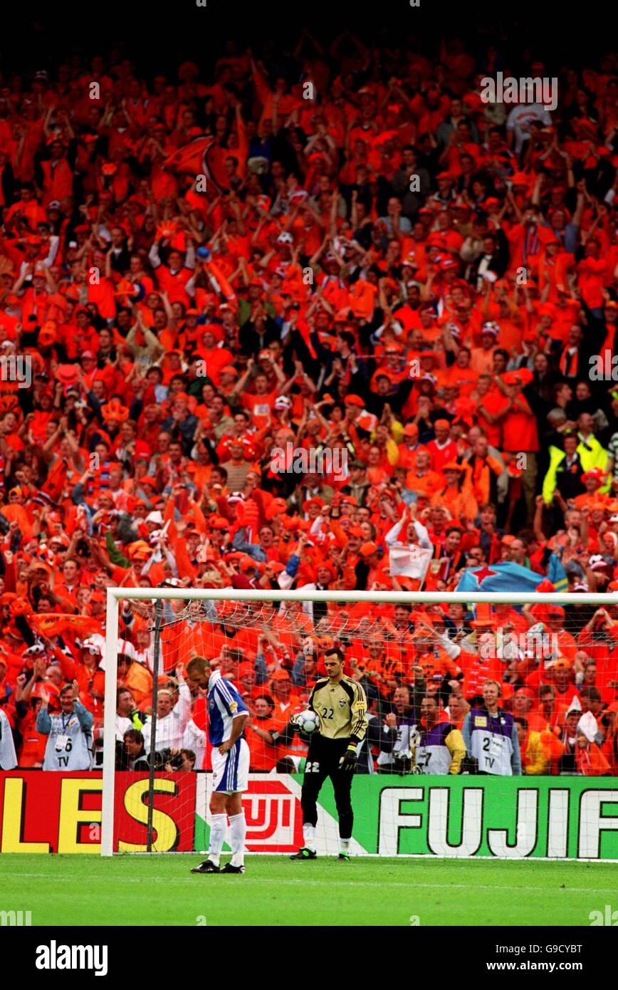 Dutch fans celebrate their team's sixth goal as Yugoslavia's Sinisa ...