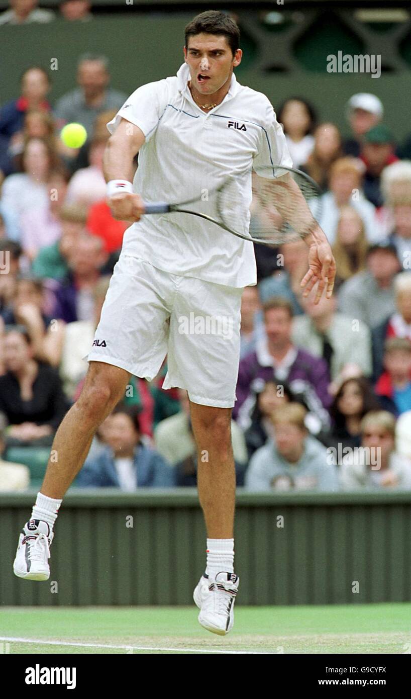 Mark philippoussis in action during his match against andre agassi hi ...
