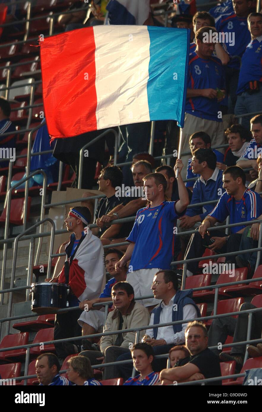 A France fan waves the national flag prior to kick off Stock Photo - Alamy