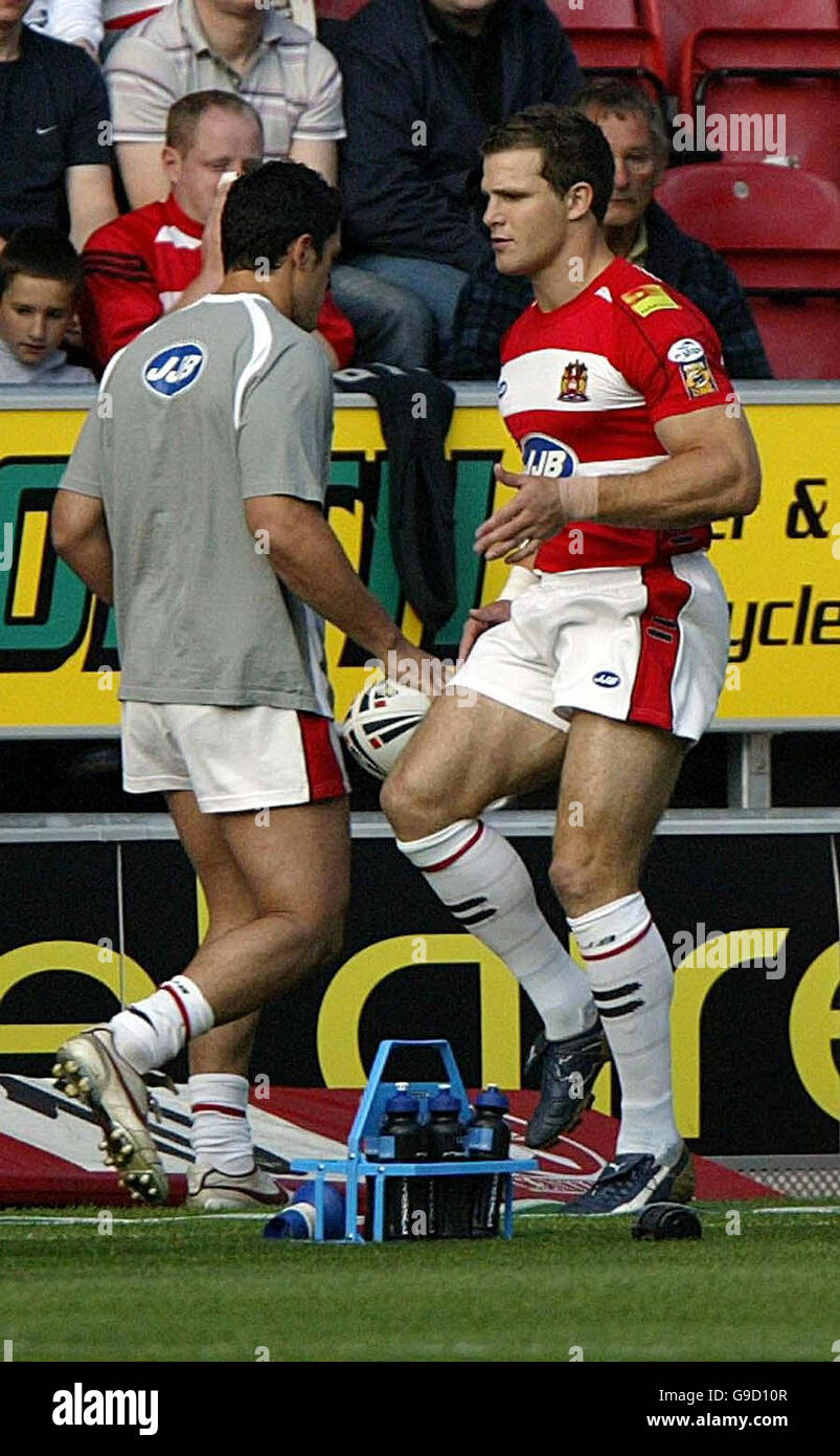 Wigan's Stuart Fielden (right) warms up prior to making his debut ...