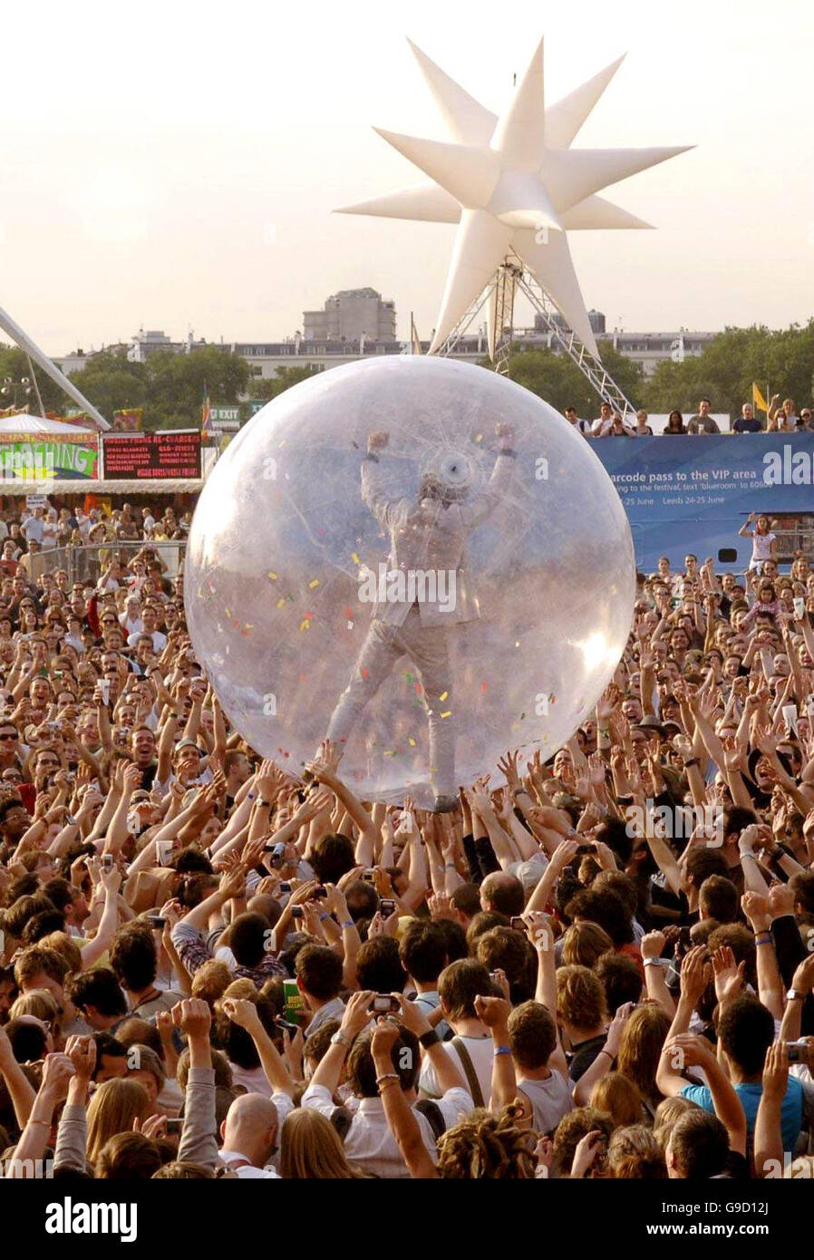 Flaming Lips singer Wayne Coyne crowd surfs in a giant sphere as the ...