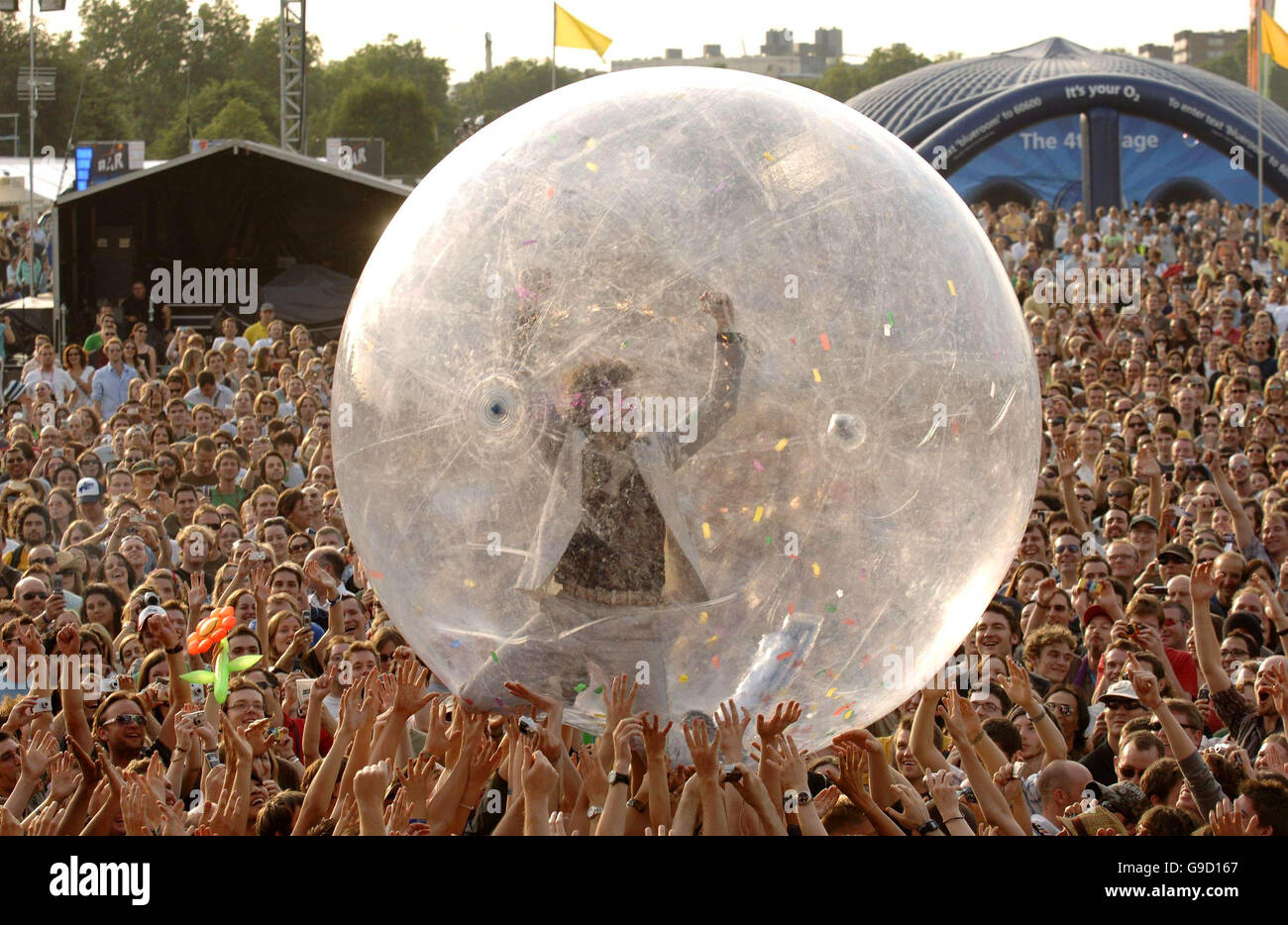 Flaming Lips singer Wayne Coyne crowd surfs in a giant sphere as the ...