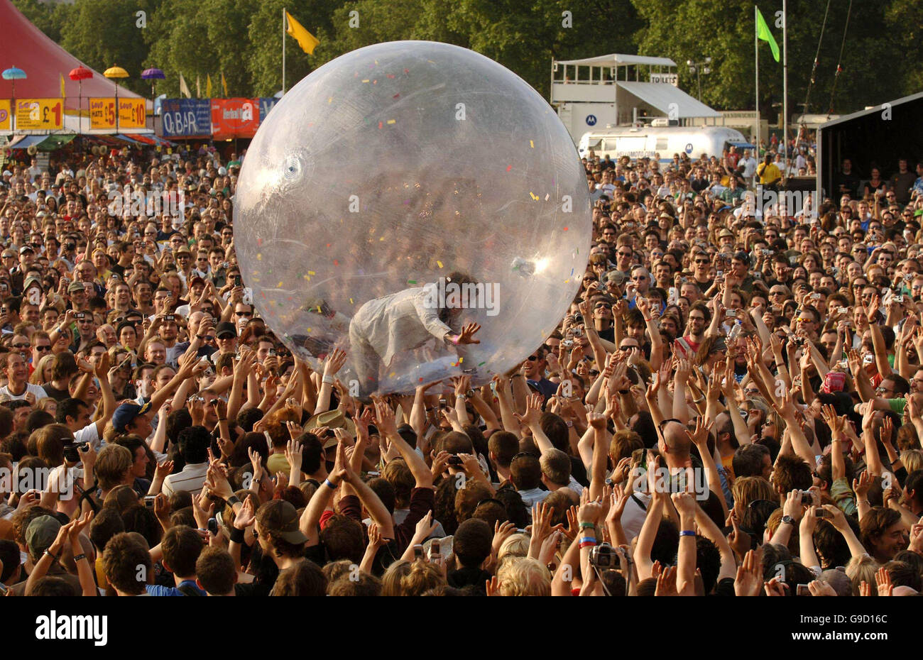 Flaming Lips singer Wayne Coyne crowd surfs in a giant sphere as the ...