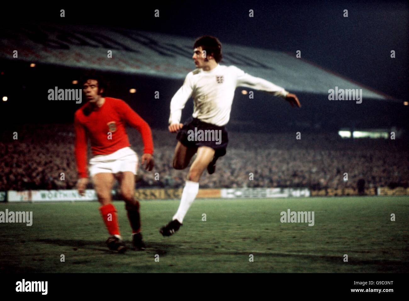 England's Kevin Keegan (r), making his international debut, fires in a ...