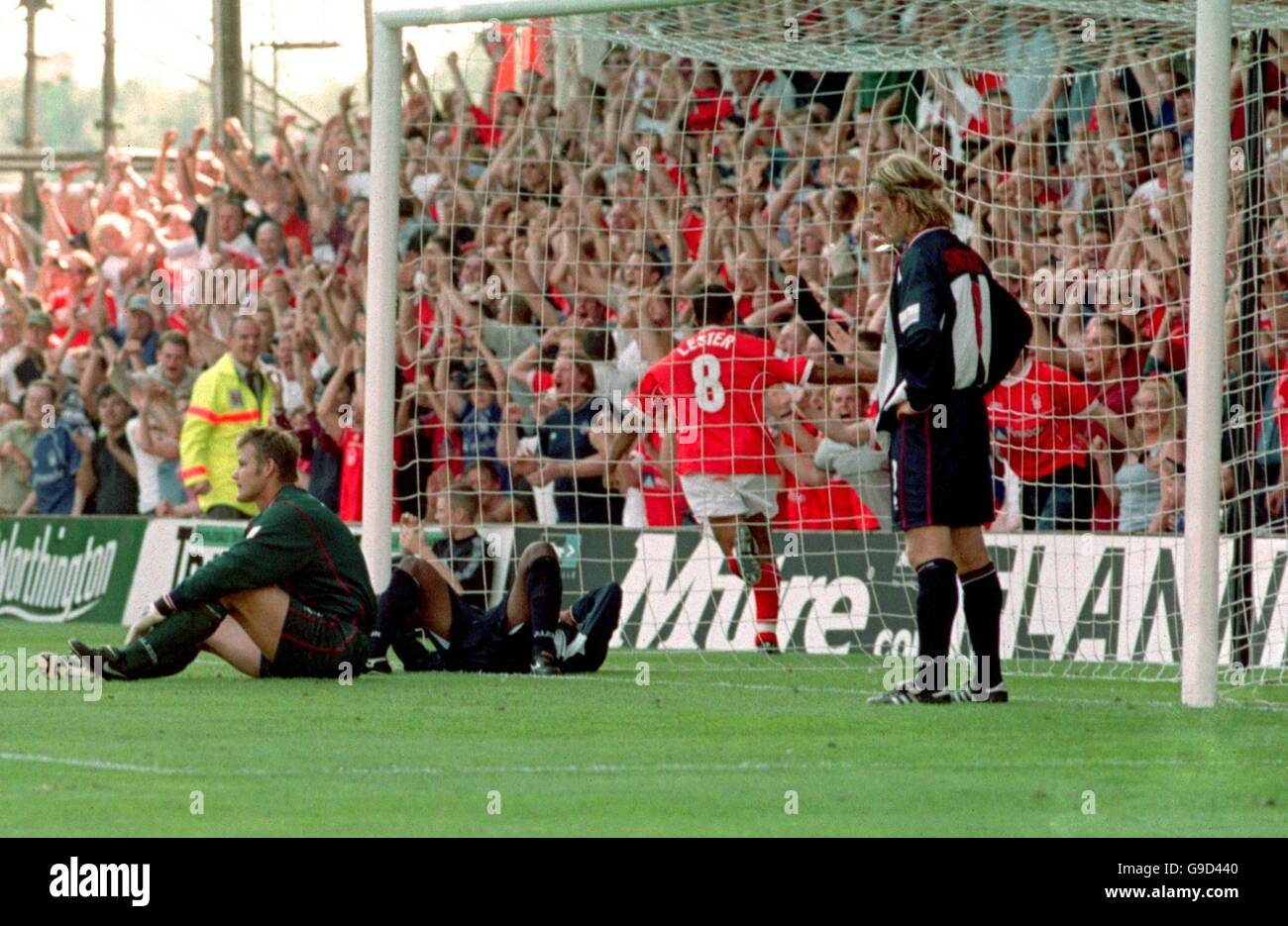 West Bromwich Albion goalkeeper Brian Jensen (l) sits, dejected, after ...