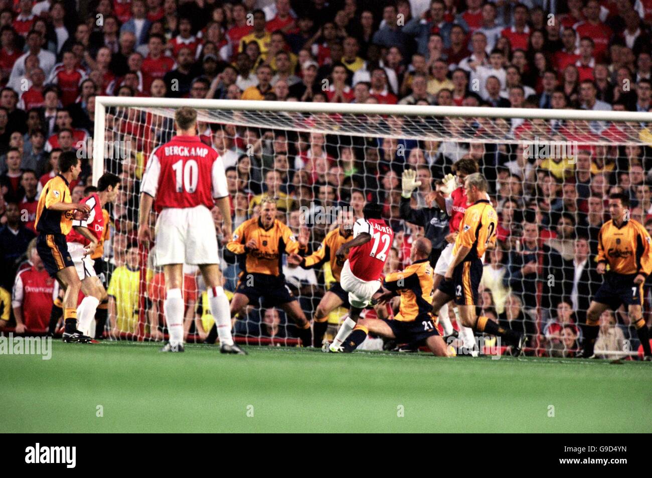 Arsenal's Lauren (number 12) scores the first goal through the crowds ...