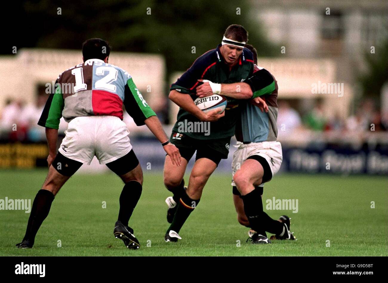 London irishs richard kirke c tries to break a tackle hi-res stock ...