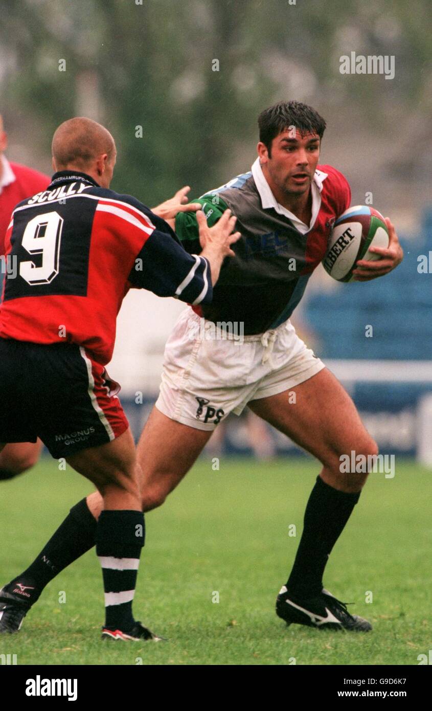 NEC Harlequins' Pat Sanderson (r) pushes off the challenge of Rotherham ...