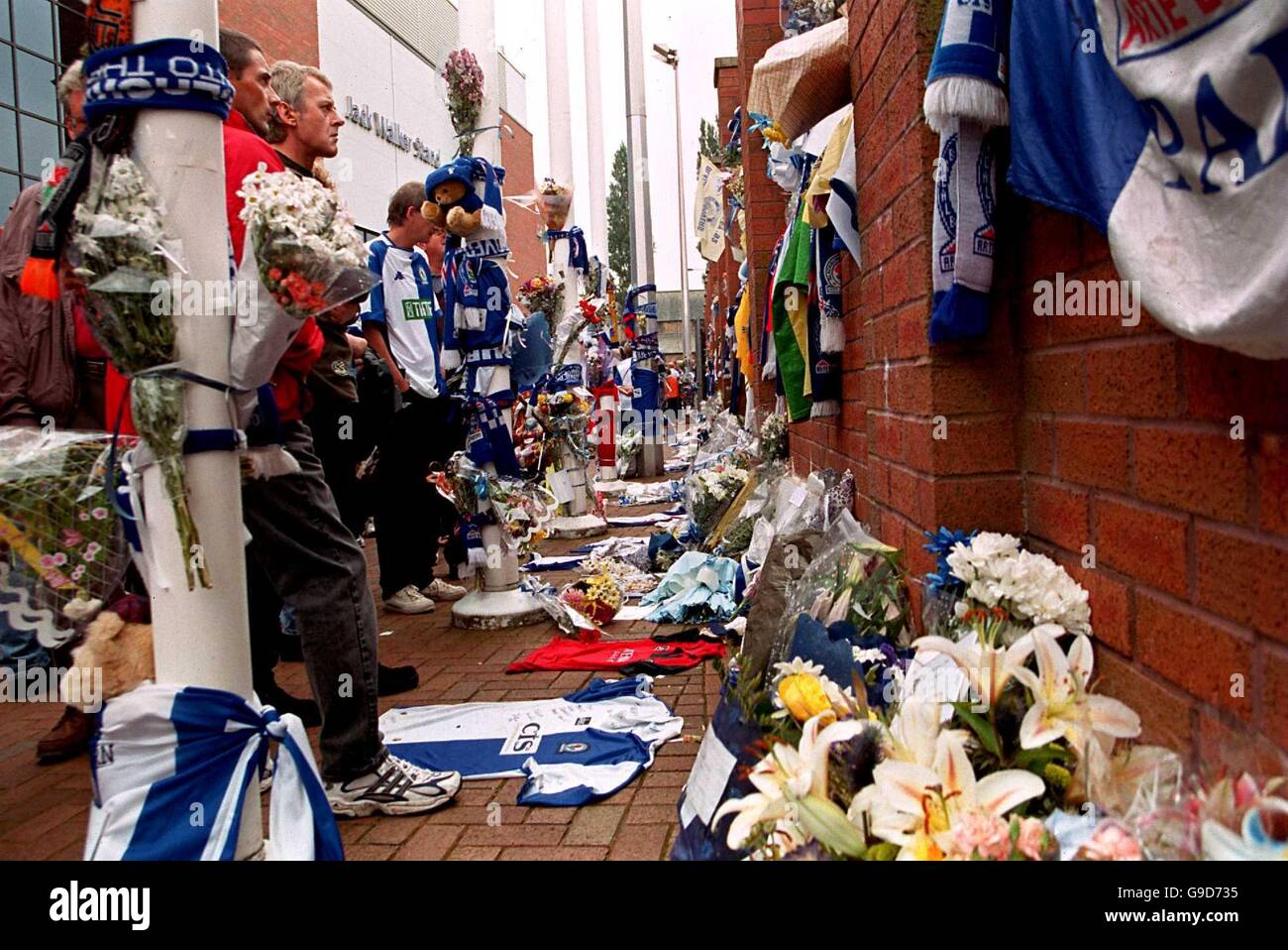 Blackburn Rovers fans look at the thousands of tributes to Rovers owner ...
