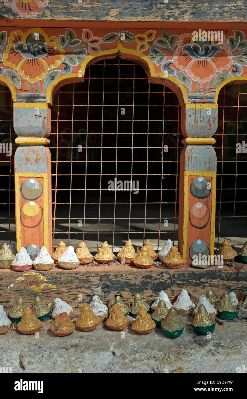 Miniature clay stupas (known as Tsa-Tsa's) outside a main stupa on the ...