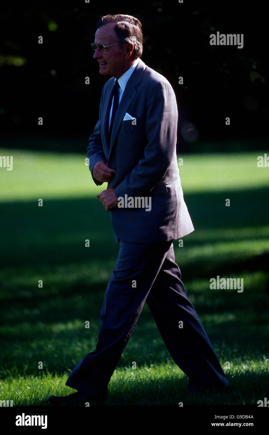 President George H.W. Bush carries hs dog Ranger to Marine One for a ...