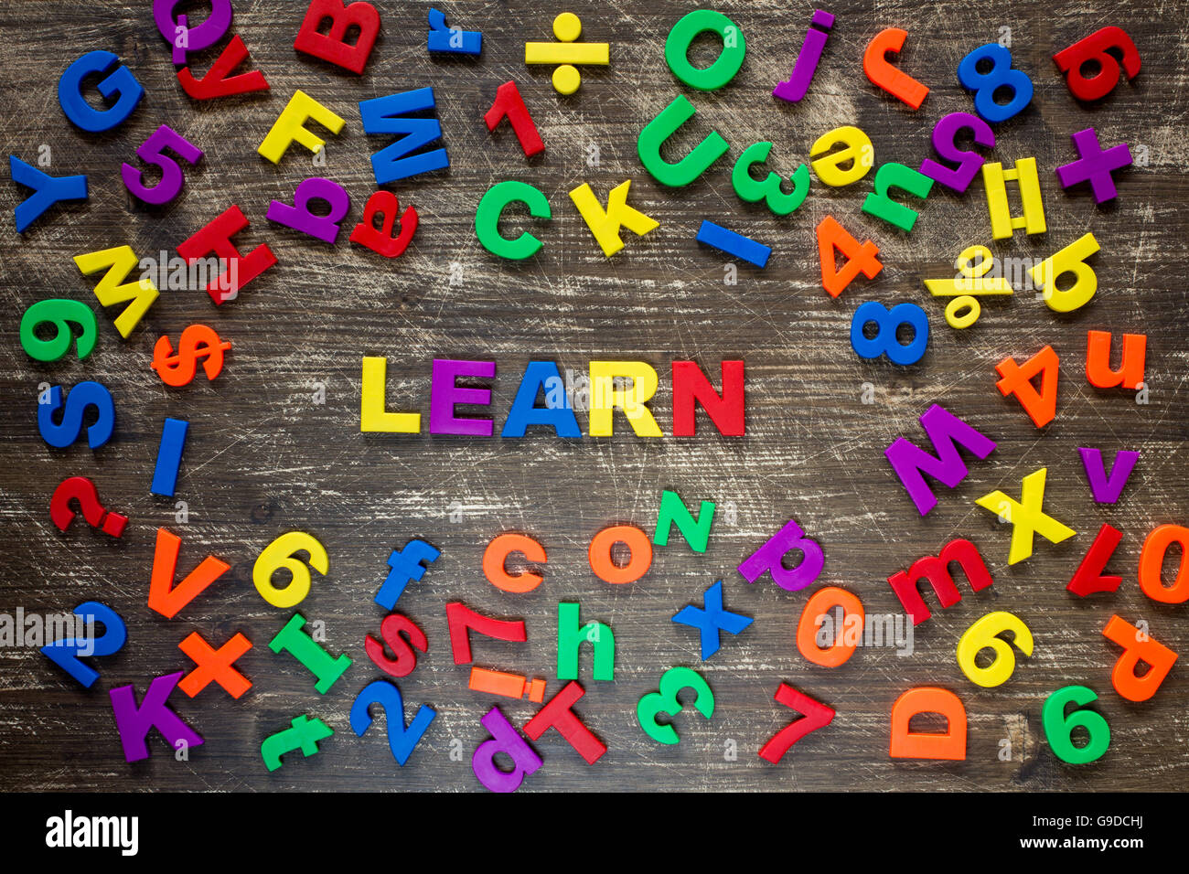 Learn written by plastic colorful letters on a wooden background Stock ...
