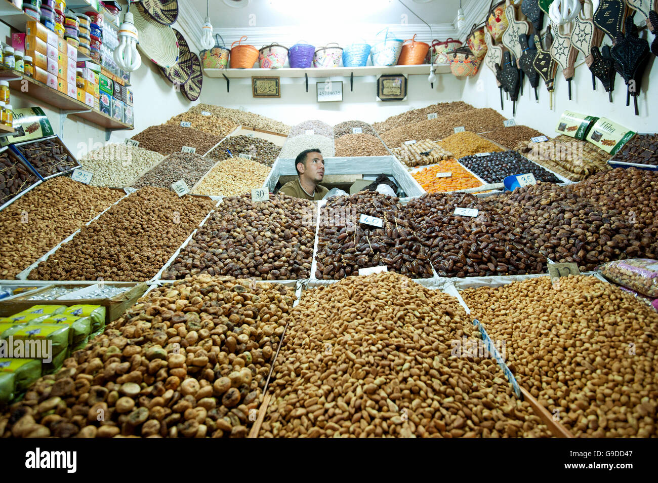 Merchant with nuts and dates in the souks of Marrakech, Morocco, North ...