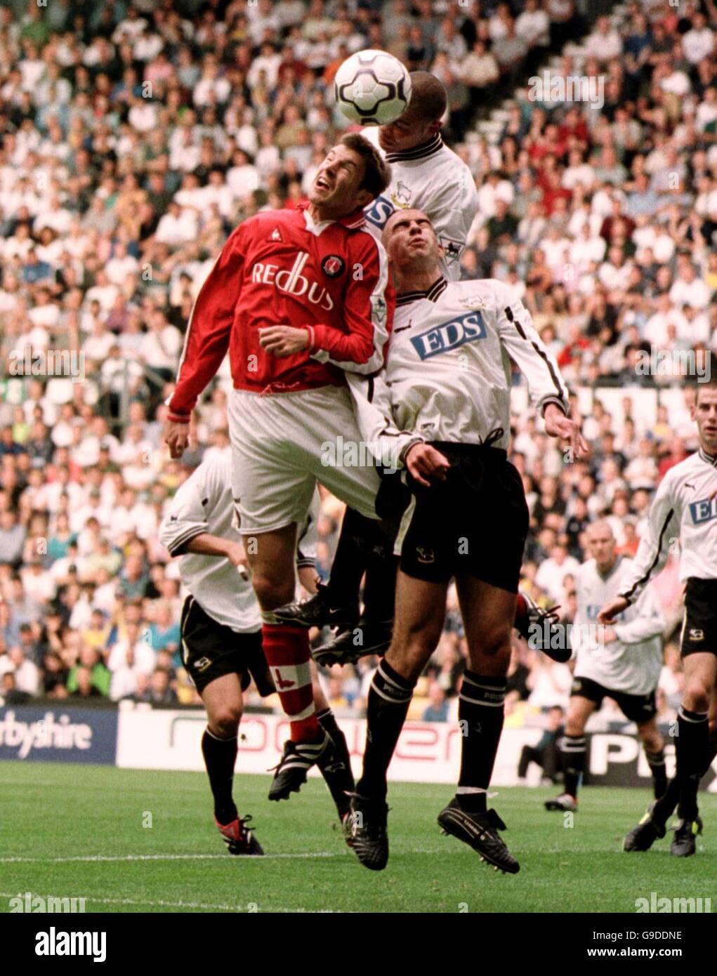 (L-R) Charlton Athletic's Andy Hunt is beaten in an aerial battle by a ...