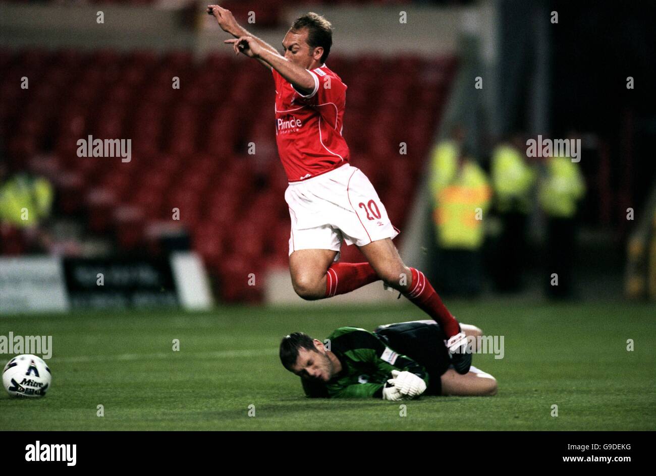 Nottingham Forest's David Platt (l) takes a tumble as Darlington ...