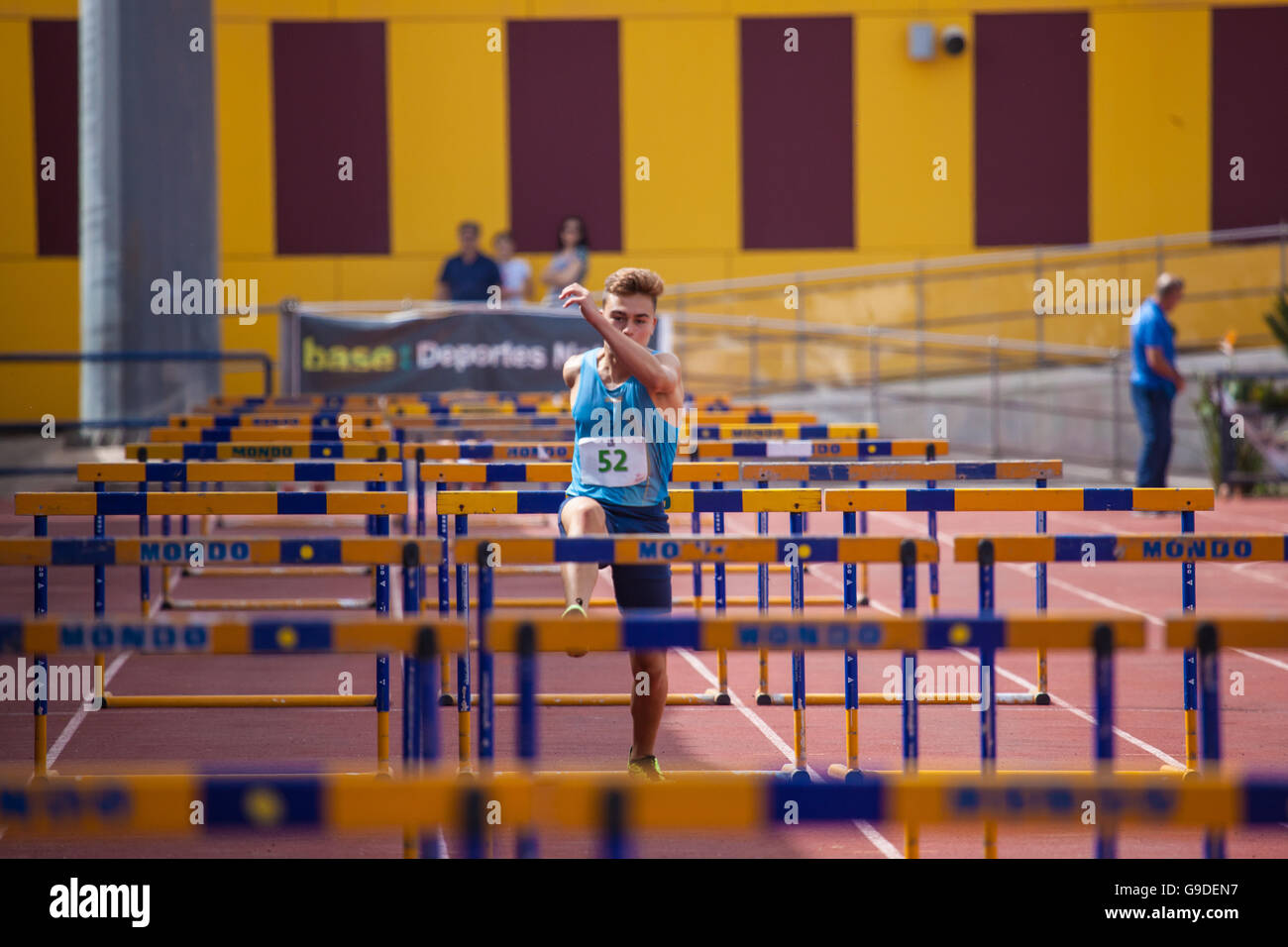 Boy jumping hurdles hi-res stock photography and images - Alamy