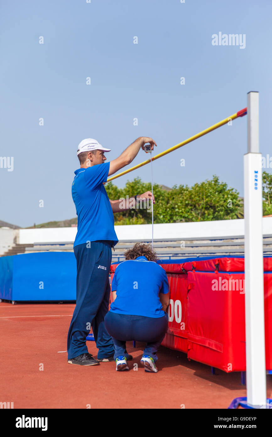 Sports boy performing the high jump on an athletic piste Stock Photo ...