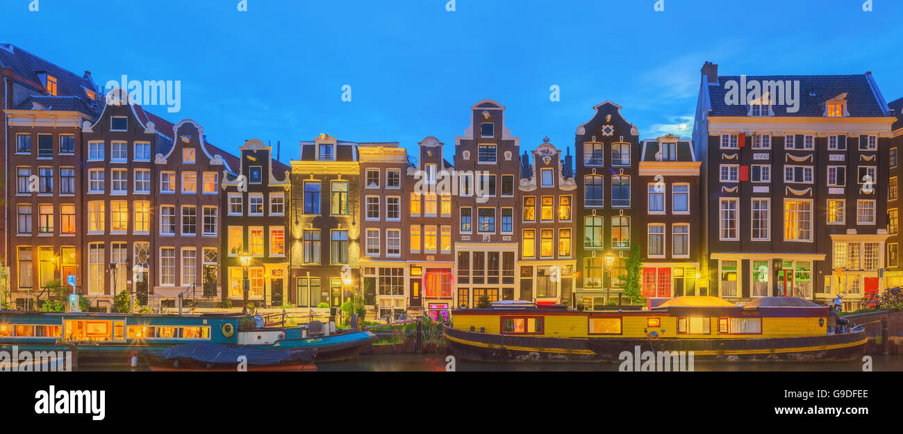 Amstel river, canals and night view of beautiful Amsterdam city ...