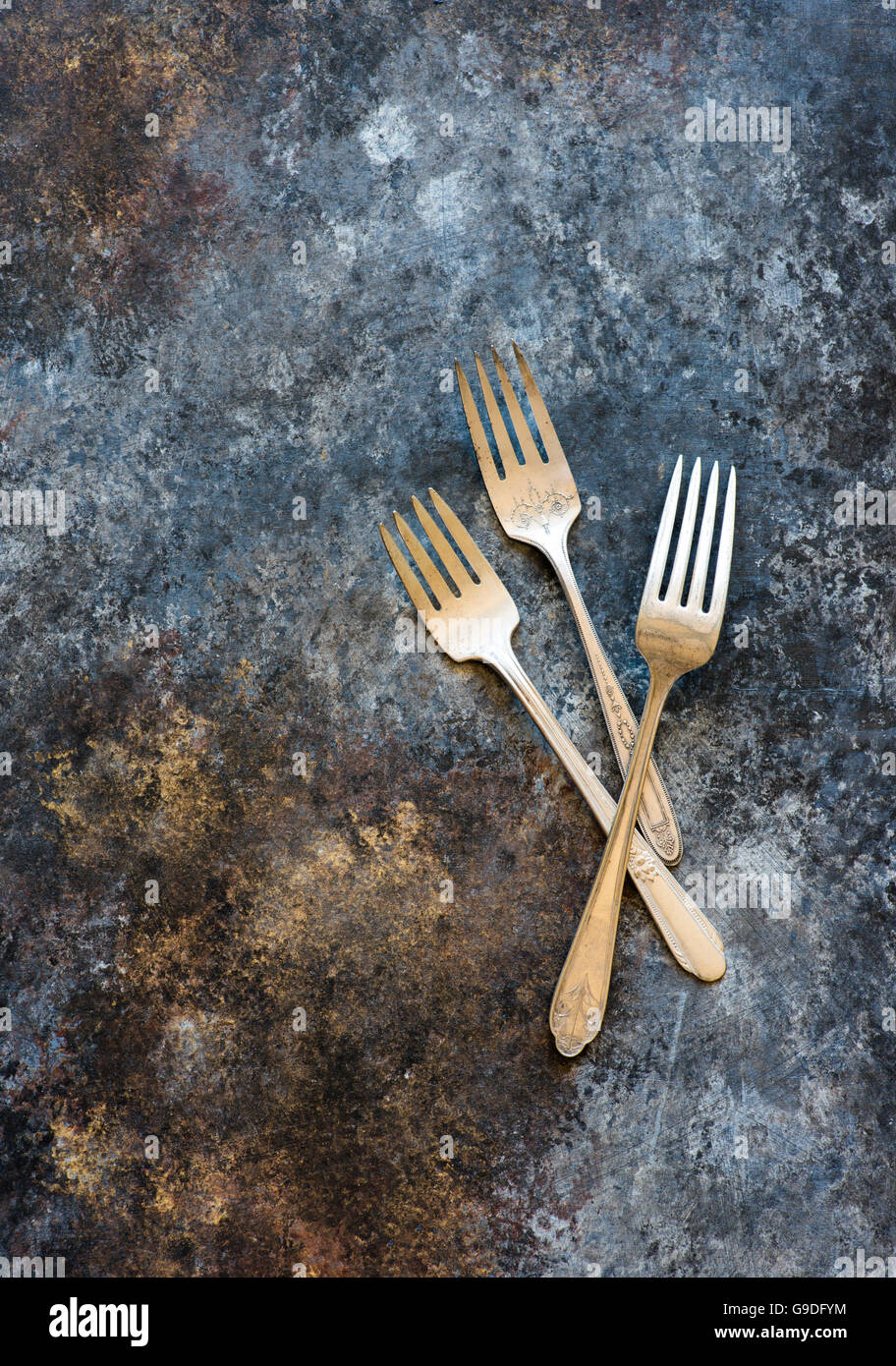 Vintage forks on rustic dark background, top view Stock Photo - Alamy
