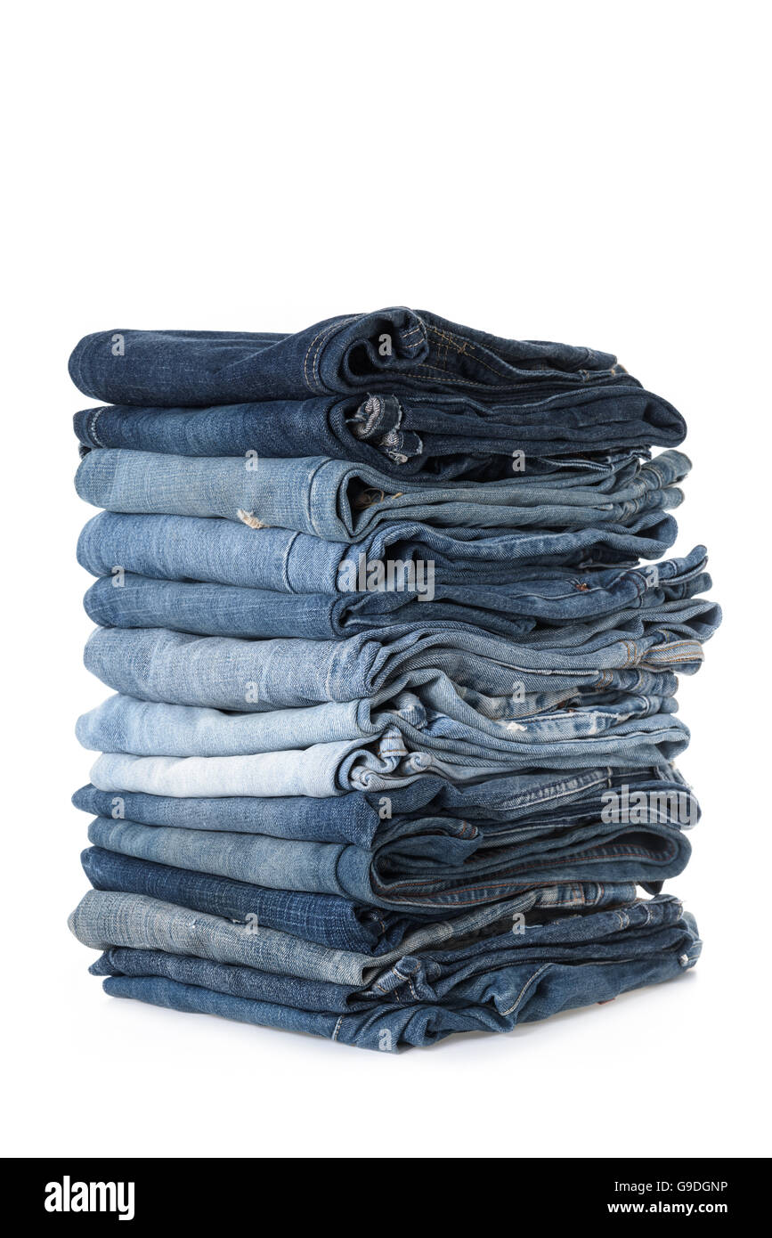 stack of jeans on white background Stock Photo - Alamy