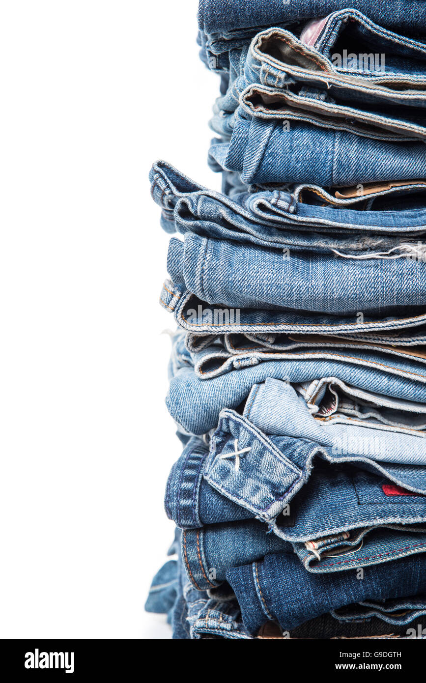 stack of jeans on white background Stock Photo - Alamy