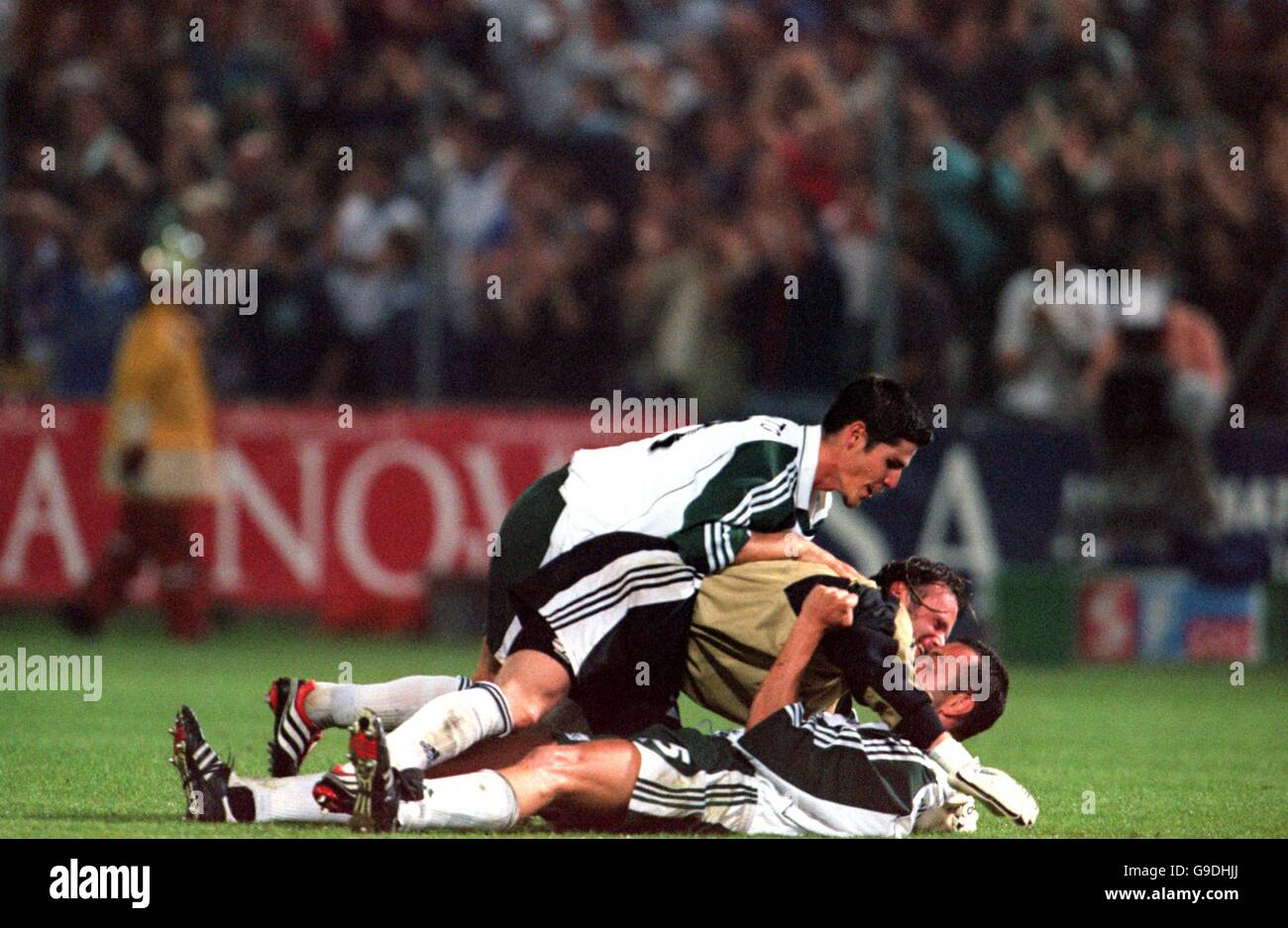 St Gallen goalkeeper Jorg Stiel jumps on Patrick Winkler in celebration ...