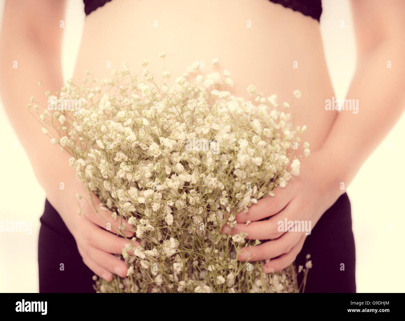pregnant woman and flower with photo filter Stock Photo - Alamy