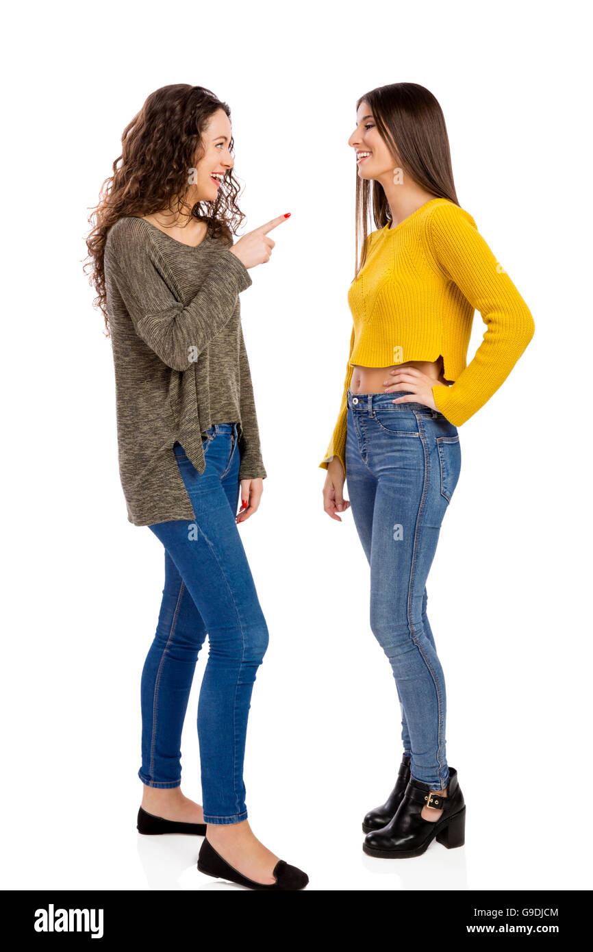 Two young friends talking Stock Photo - Alamy