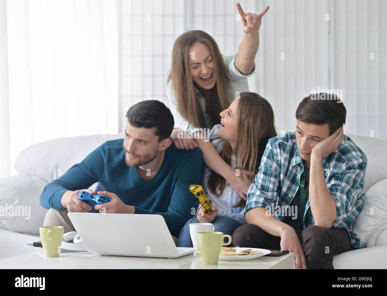 happy friends and laptop Stock Photo - Alamy