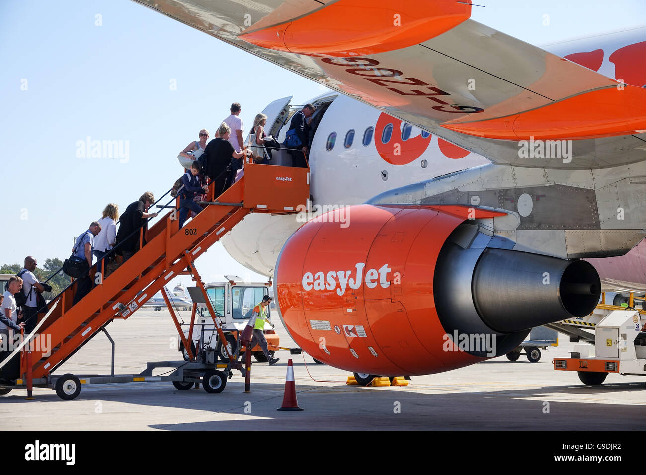 Holiday makers boarding an easyJet pane at Ibiza airport,Spain Stock ...