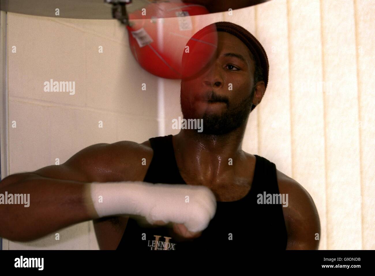 Lennox Lewis's hands work faster than the camera shutter, as he trains ...