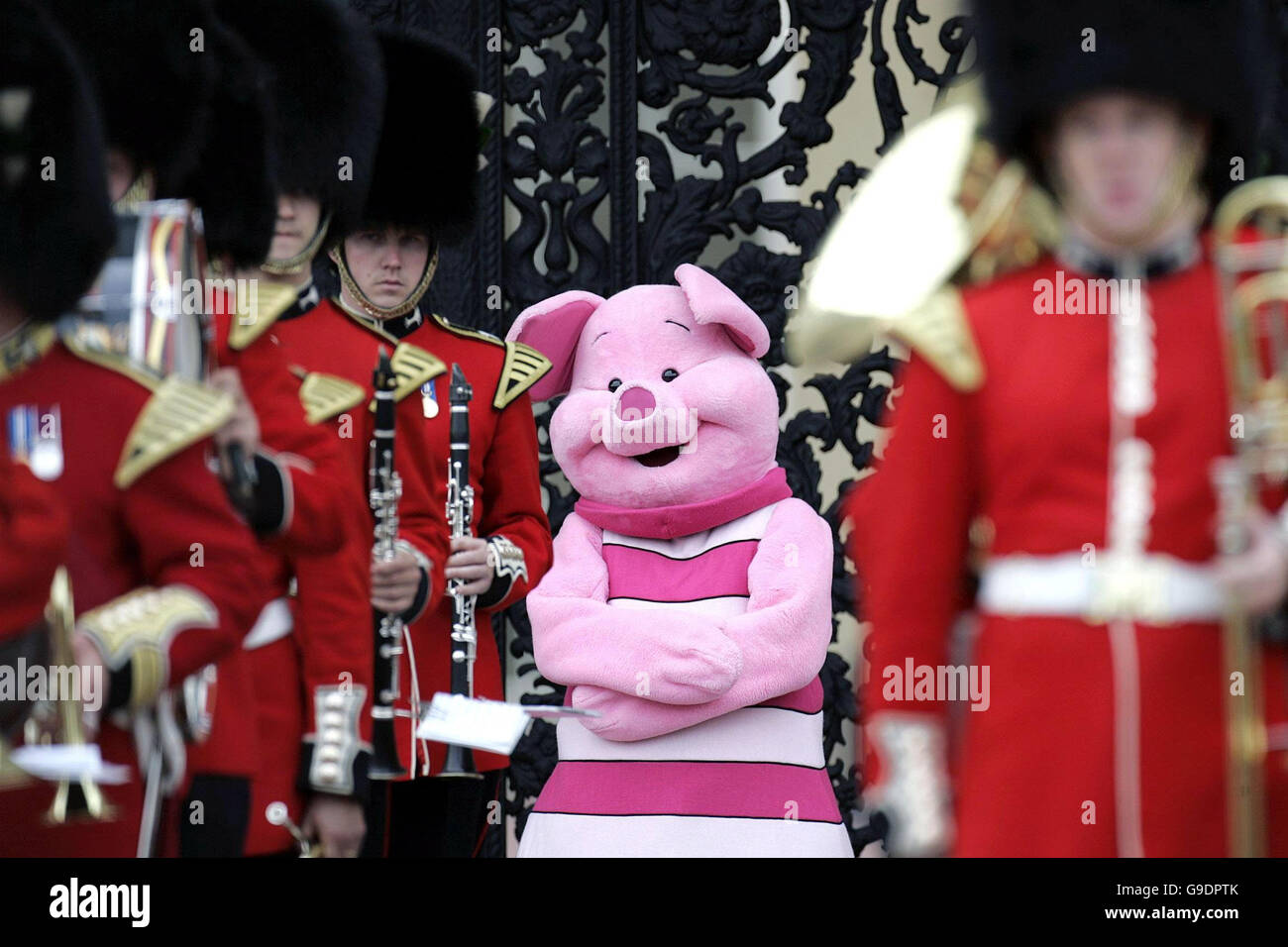 Piglet lines up with the band in the forecourt of Buckingham Palace as ...