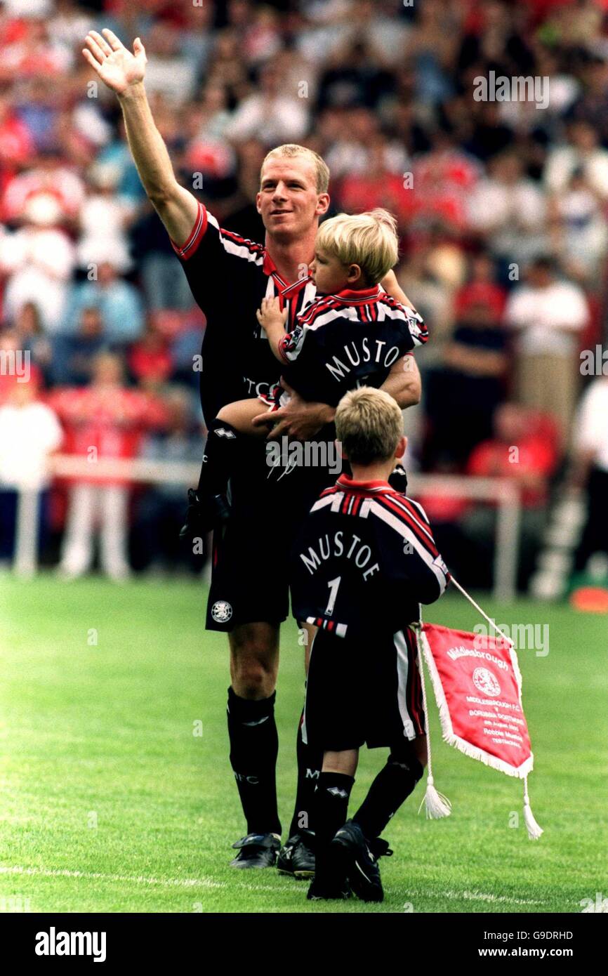 Middlesbrough's Robbie Mustoe salutes the crowd that has turned out for ...