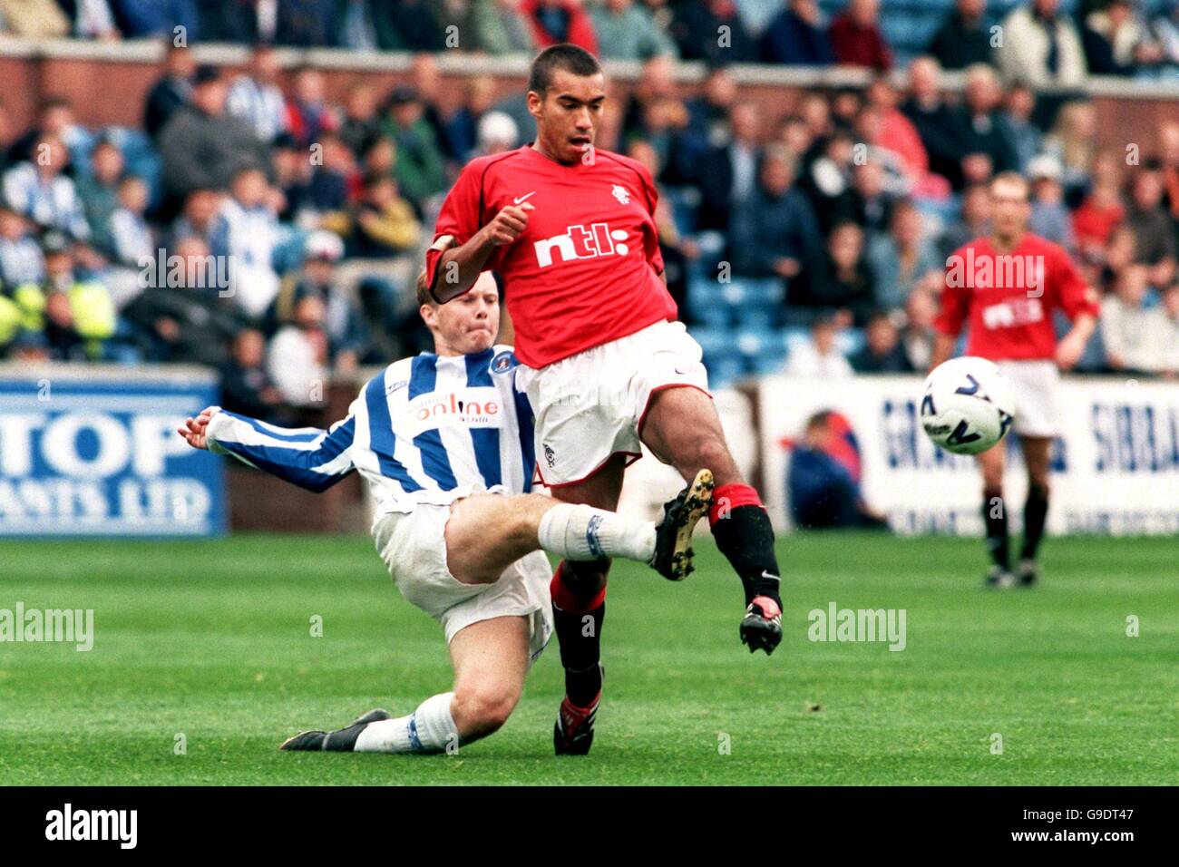 Kilmarnocks alan mahood slides to challenge rangers giovanni van ...