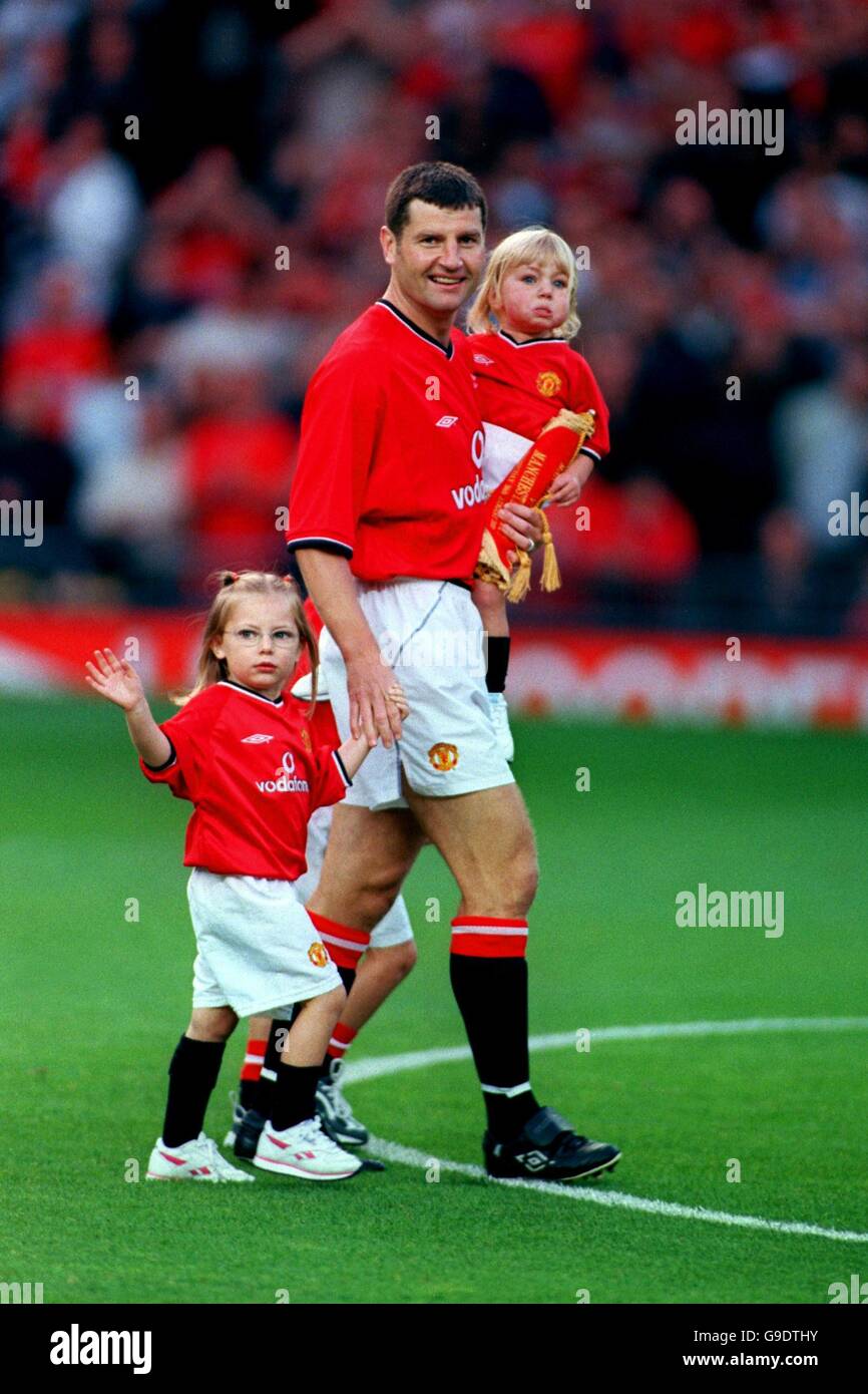 Manchester United's Denis Irwin celebrates his testimonial with ...