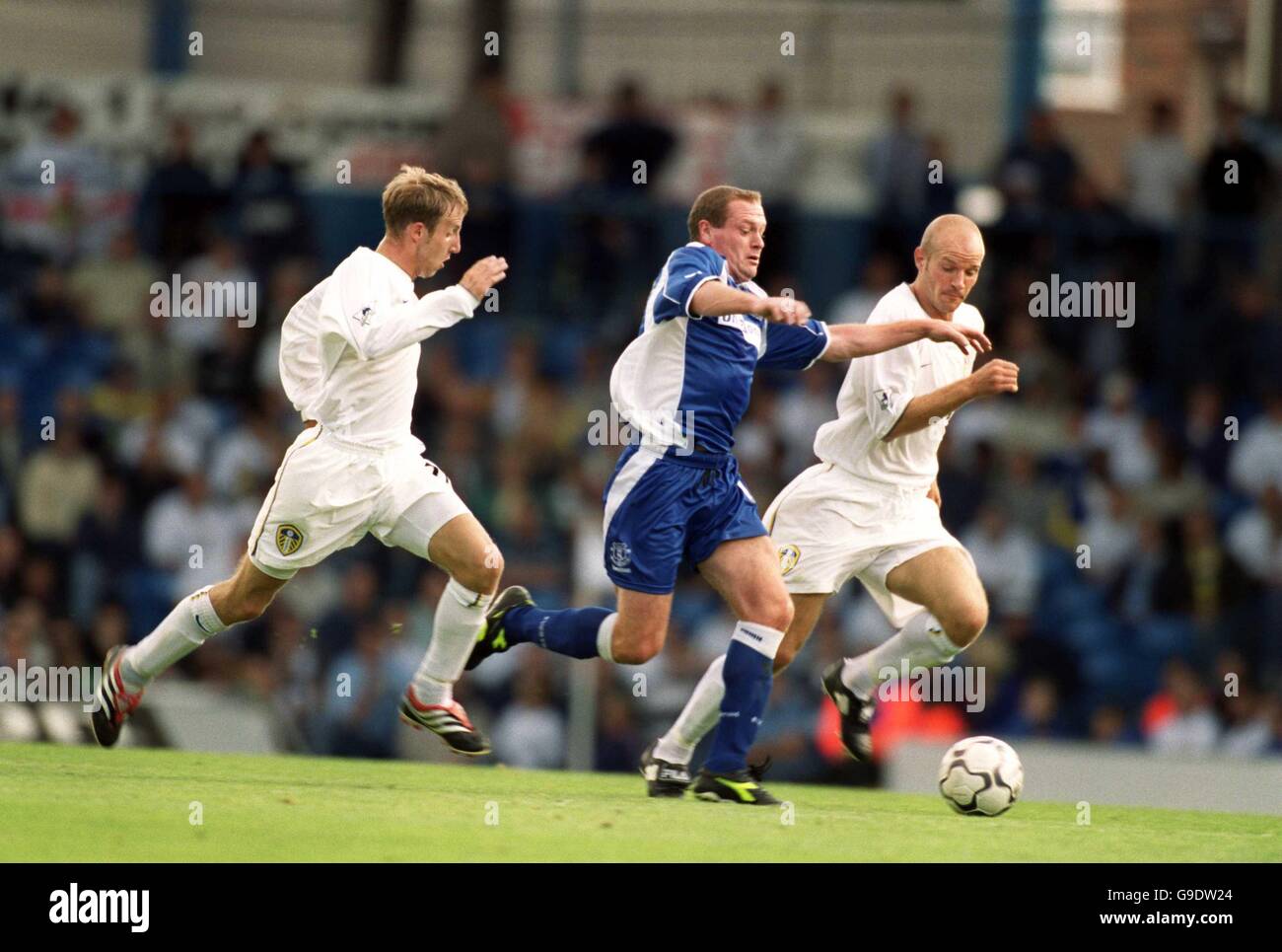 Paul Gascoigne of Everton (c) runs ahead of Lee Bowyer (l) and Danny ...