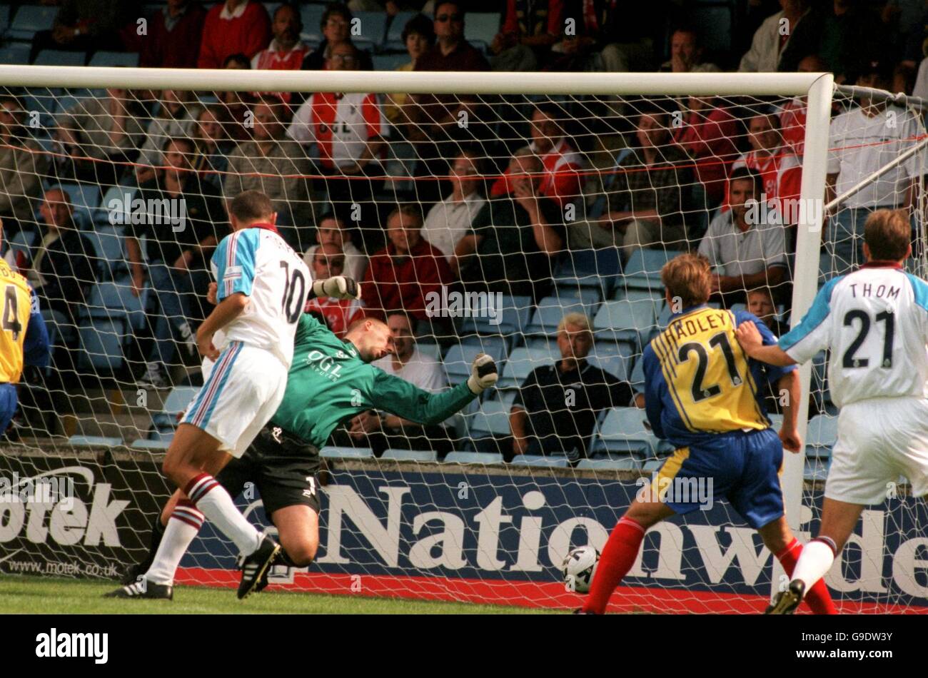 Kidderminster Harriers goalkeeper Tim Clarke (c) tries to stop ...