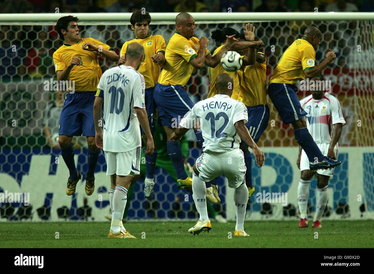 France's Thierry Henry watches as his freekick hits the Brazilian wall ...