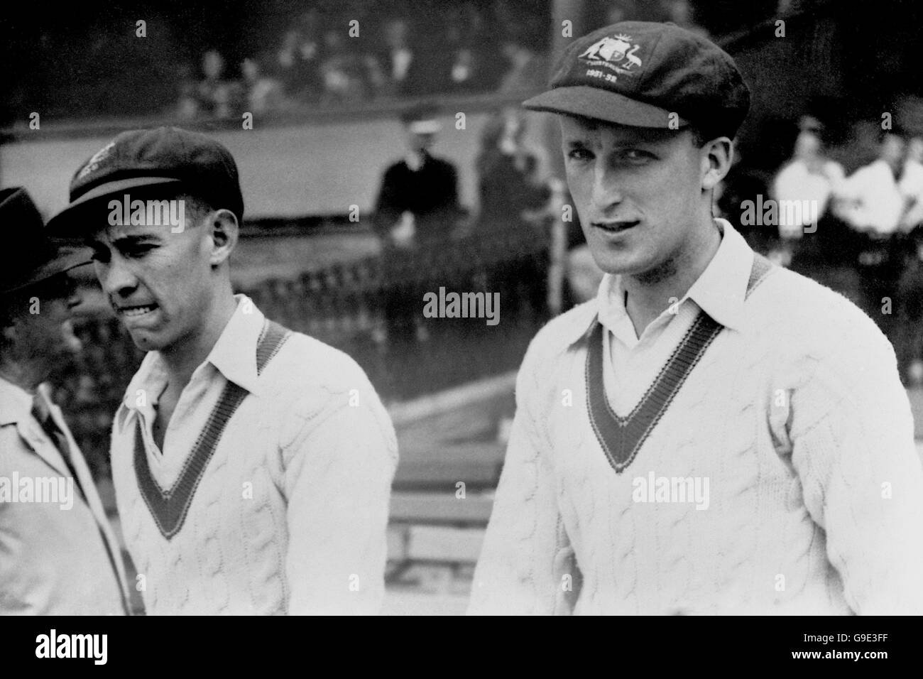 (L-R) Australia's Ken Archer and Graeme Hole walk out into the field ...
