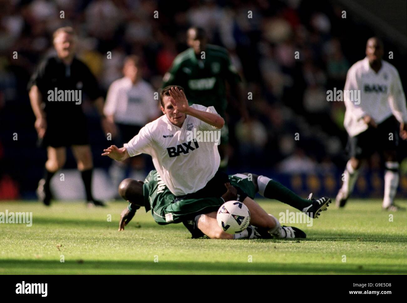 Preston North End's Michael Appleton is brought down by Wimbledon's ...