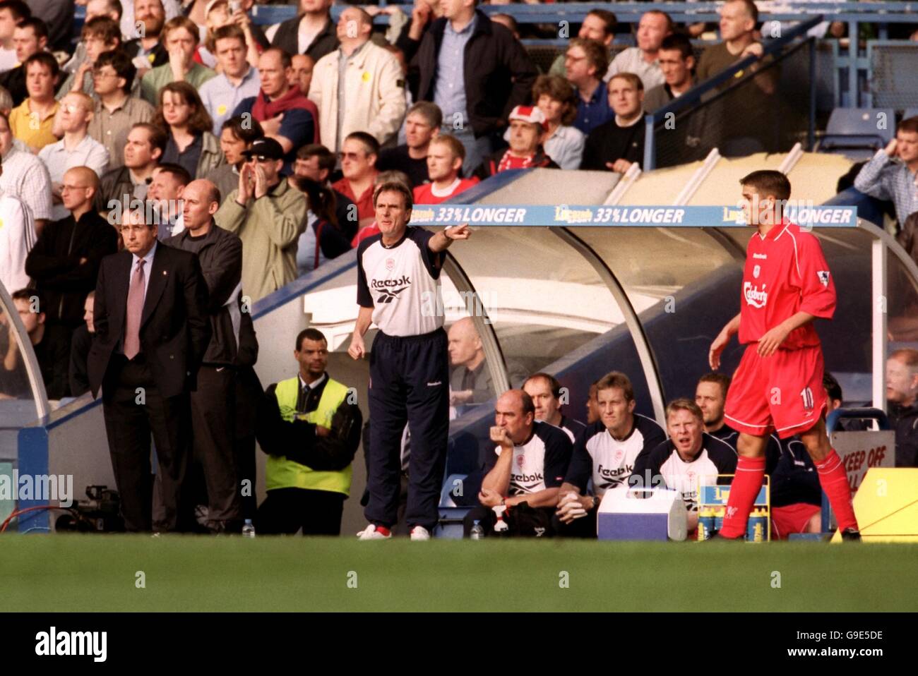 Liverpool assistant manager Phil Thompson (c) orders his players to ...